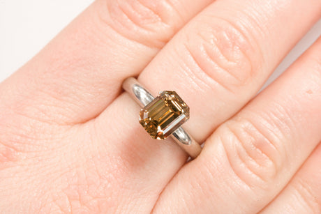 Ring with square brown diamond